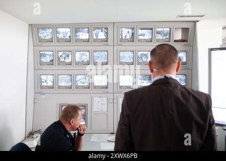 Police officers monitor stadium security during a sporting event ...