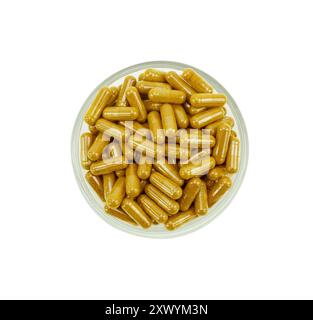 Bowl with turmeric powder and capsules on table, closeup Stock Photo ...