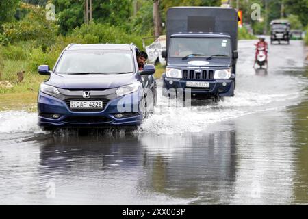 Colombo, Sri Lanka. 21st Aug, 2024. A truck rides on a waterlogged road ...