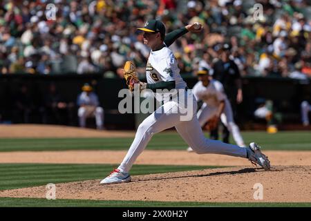 Athletics pitcher Mason Miller throws to the Toronto Blue Jays during ...