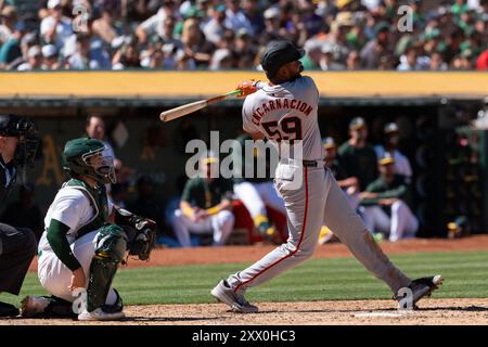 San Francisco Giants' Jerar Encarnacion hits against the Los Angeles ...