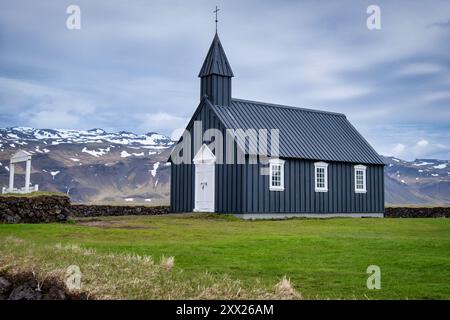 Budakirkja (Black Church) with mountain backdrop, Budir, Snaefellsnes ...