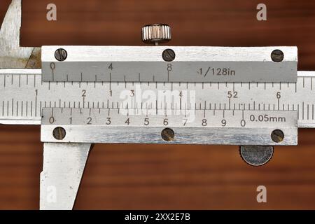 Caliper for precision measuring graduated in fractional inches and ...