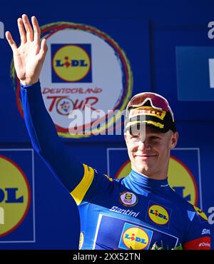 Milan Jonathan of Lidl-Trek the winner of the stage on the podium after ...