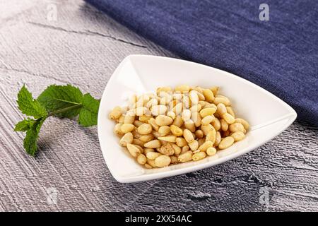 Delicous Peeled cedar nut in the bowl Stock Photo - Alamy