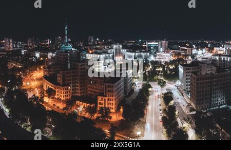 Aerial night illuminated Freedom Square with Derzhprom and Karazin ...
