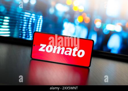 In this photo illustration, the Zomato logo seen displayed on a ...