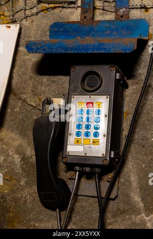 A mine phone installed on a wall in a deep mine Stock Photo - Alamy