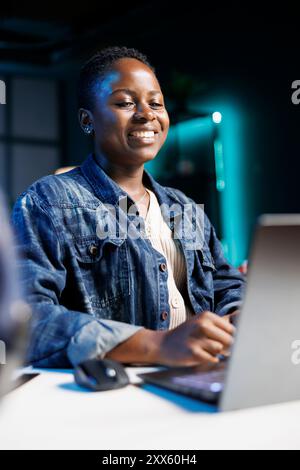 Studying diligently. Portrait of a smiling young university student ...