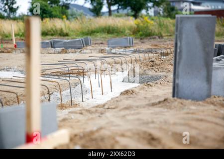 Dugged holes filled with concrete on a construction site. Building ...