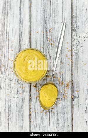 Fresh made Mustard on a vintage background (close-up shot Stock Photo ...