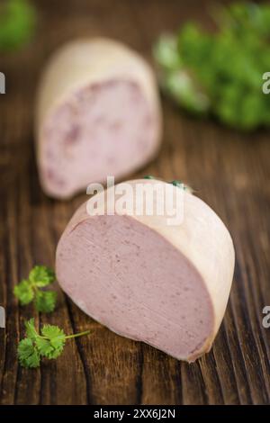 Liverwurst on a vintage background as detailed close-up shot (selective ...