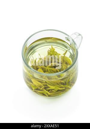 Longjing tea in glass cup isolated on white background Stock Photo - Alamy
