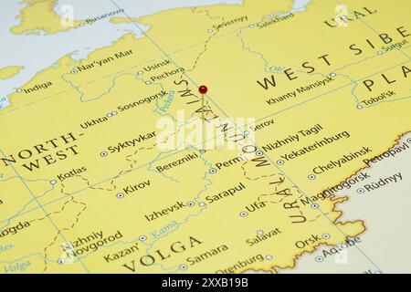 Close up to a Bilibino city with a red pin needle into Russia country ...