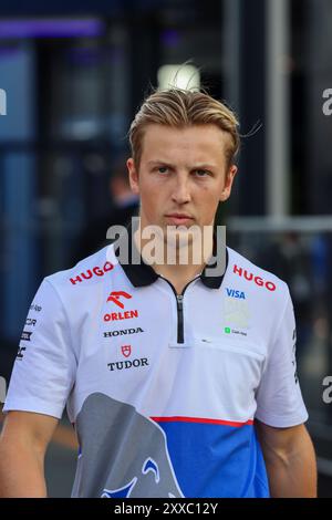 Racing Bulls driver Liam Lawson of New Zealand walks through the ...