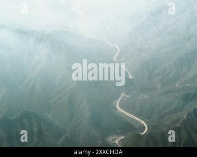 A valley filled with smog as seen from a plane on approach to Beijing ...