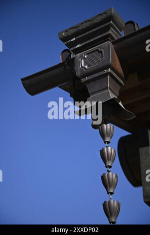 A Japanese rain chain or kusari-doi which is a traditional rain ...
