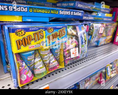 Packages of fireworks stand on display in a Costco warehouse Tuesday ...