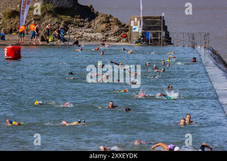 Participants taking part in Clevedons swim run Stock Photo - Alamy