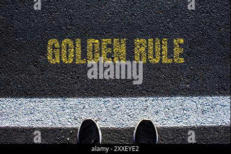Golden rule message written on ripped torn paper piece with red ...