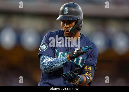 Seattle Mariners' Julio Rodriguez celebrates a single with first base ...