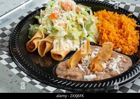 A view of a taquitos entree Stock Photo - Alamy