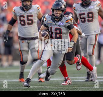 (12) Nathan Rourke of the BC Lions sets to throw the ball during the ...