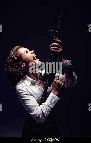Female assassin in suit Stock Photo - Alamy
