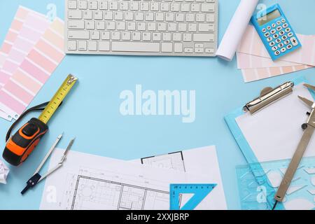 Frame made of architect's supplies with house plans on green background ...