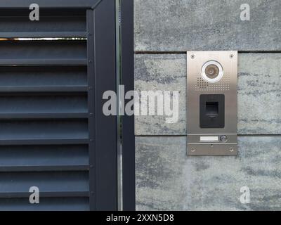 Stainless Steel Intercom on Concrete Wall Stock Photo - Alamy