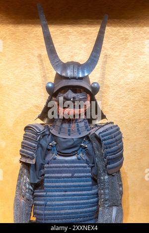 A collection of intricately detailed Japanese samurai armor suits ...