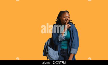Stern african american woman doing shushing hand gesturing, irritated ...