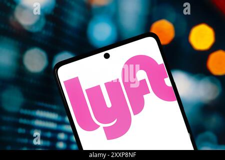 In this photo illustration, the Lyft Inc company logo is seen displayed ...
