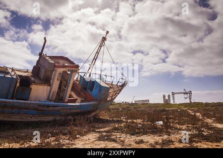 A broken ship lies on the beach Stock Photo - Alamy