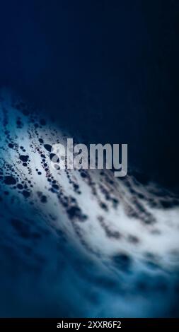 Defocused light fluid. Gasoline emulsion. Green blue purple color ink ...