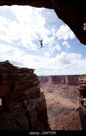 A woman highlining at the fruit bowl in Moab, Utah Stock Photo - Alamy