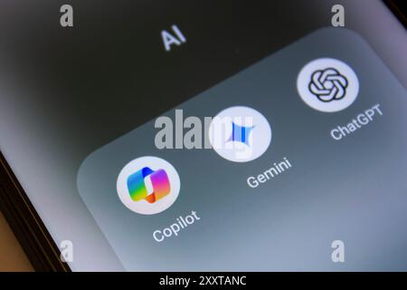 Google Gemini, OpenAI ChatGPT and Microsoft Copilot app icon on phone screen. Assorted AI app ...