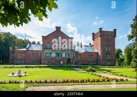 The road leads to the main entrance of the manor house in Puikule ...