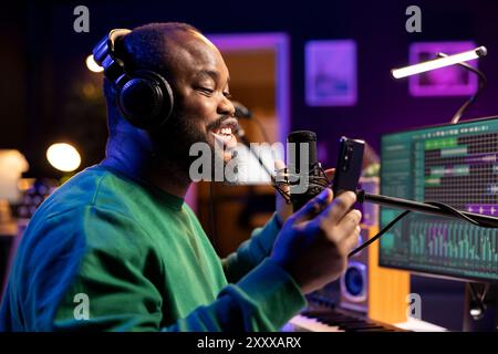 Skilled artist composer singing an acoustic version of his new song ...