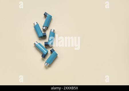 Asthma inhalers on beige background Stock Photo - Alamy