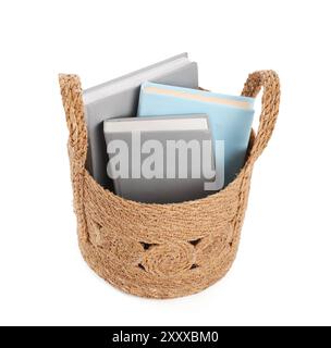Wicker basket with books isolated on white background Stock Photo - Alamy