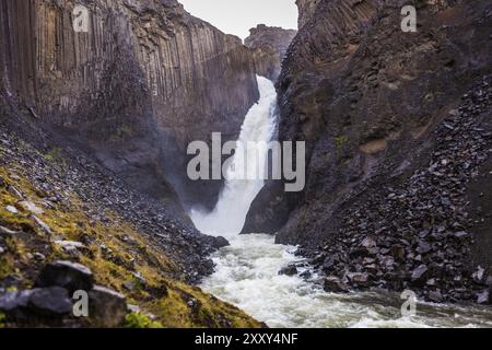 Litlanesfoss waterfall gushing through volcanic rock on Iceland Stock ...