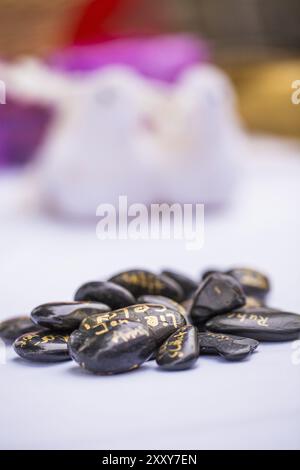Black stones with good wishes and congratulations Stock Photo - Alamy
