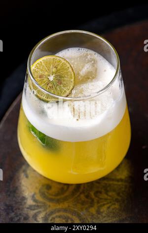 Satsuma cocktail in glass on dark background Stock Photo - Alamy