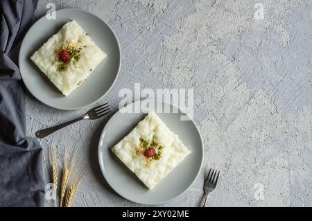 Traditional Turkish Ramadan dessert gullac, milky dessert with ...