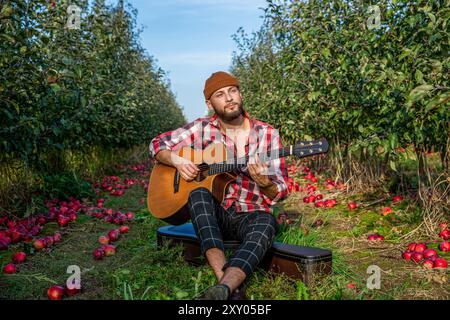 Young handsome man with beard plays billiards Stock Photo - Alamy