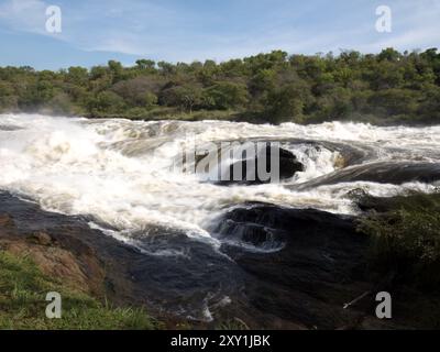 View of Rapids at top of Waterfull, Nile River, with rainbow, Murchison ...