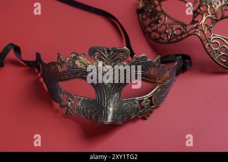 Two beautiful carnival masks on red background Stock Photo - Alamy