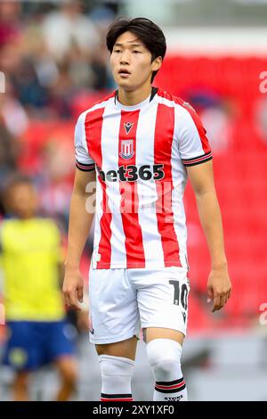 #10, Bae Jun-Ho of Stoke City moves to intercept as #7, Tatsuhiro ...