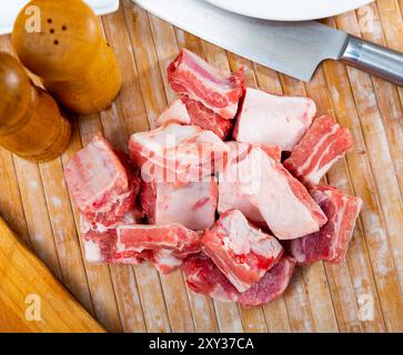 Unprepared pork ribs chopped on table and ready-to-cook Stock Photo - Alamy